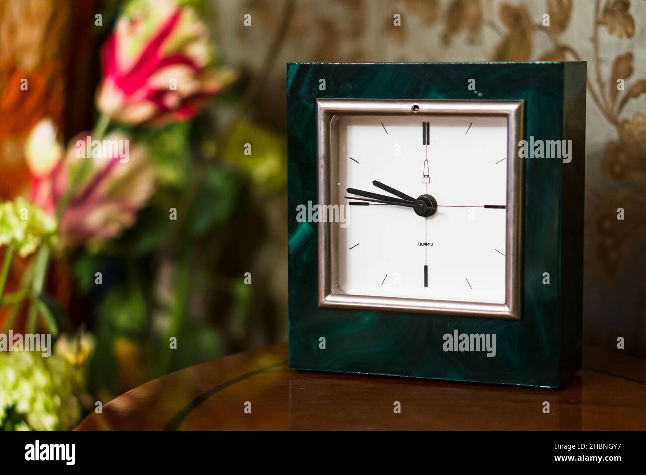 ROTTERDAM, NETHERLANDS - Feb 21, 2019: A square clock standing on a ...