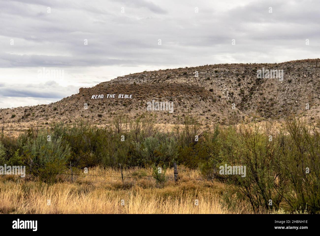 read the bible sign on the side of a hill in the desert of western ...