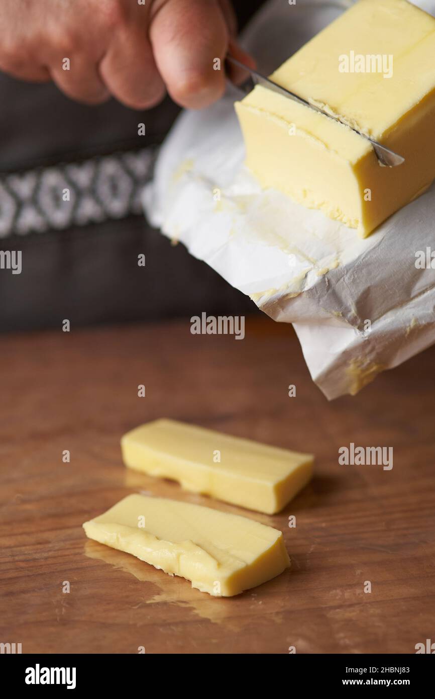 Man slices butter hi-res stock photography and images - Alamy