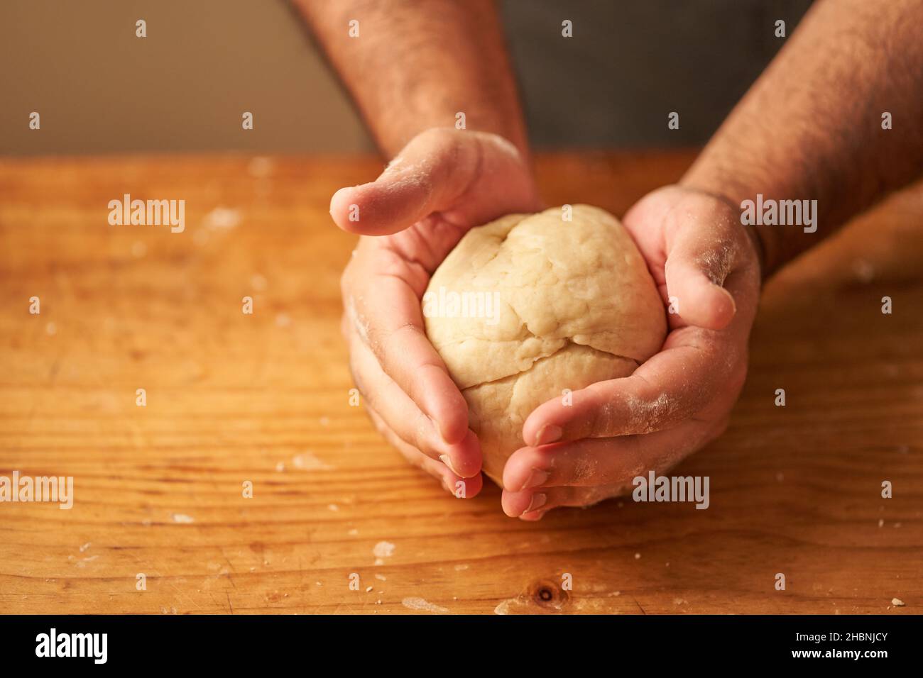 cook's hands roll dough before getting fresh dough for baking Stock ...