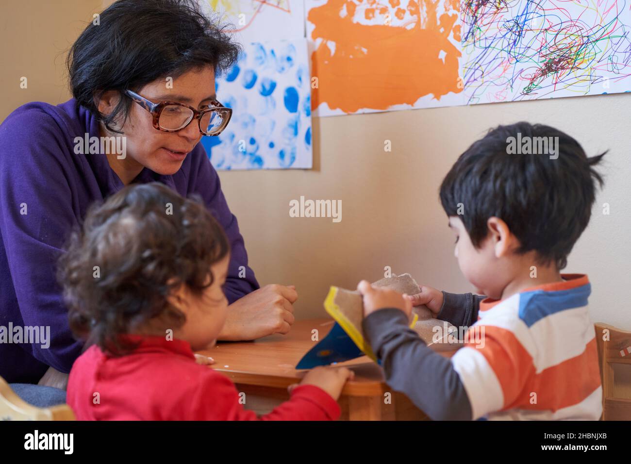 mother teaches her children while drawing Stock Photo - Alamy
