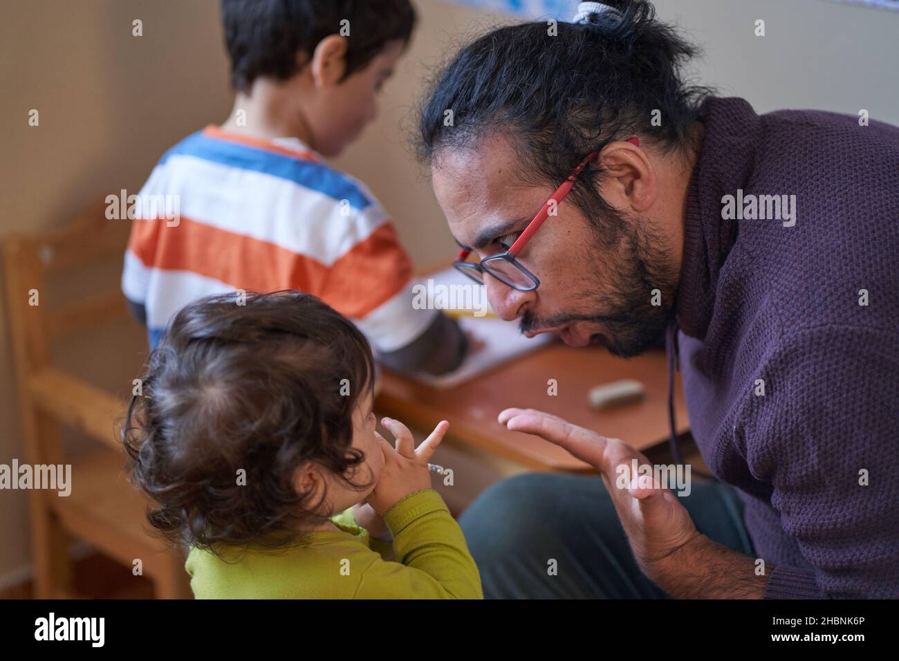 Father is surprised by his son Stock Photo - Alamy