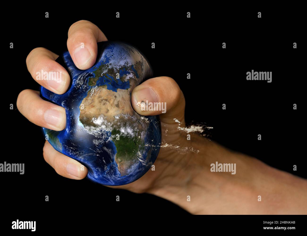 Planet Earth crushed by a human fist. Elements of this image furnished ...