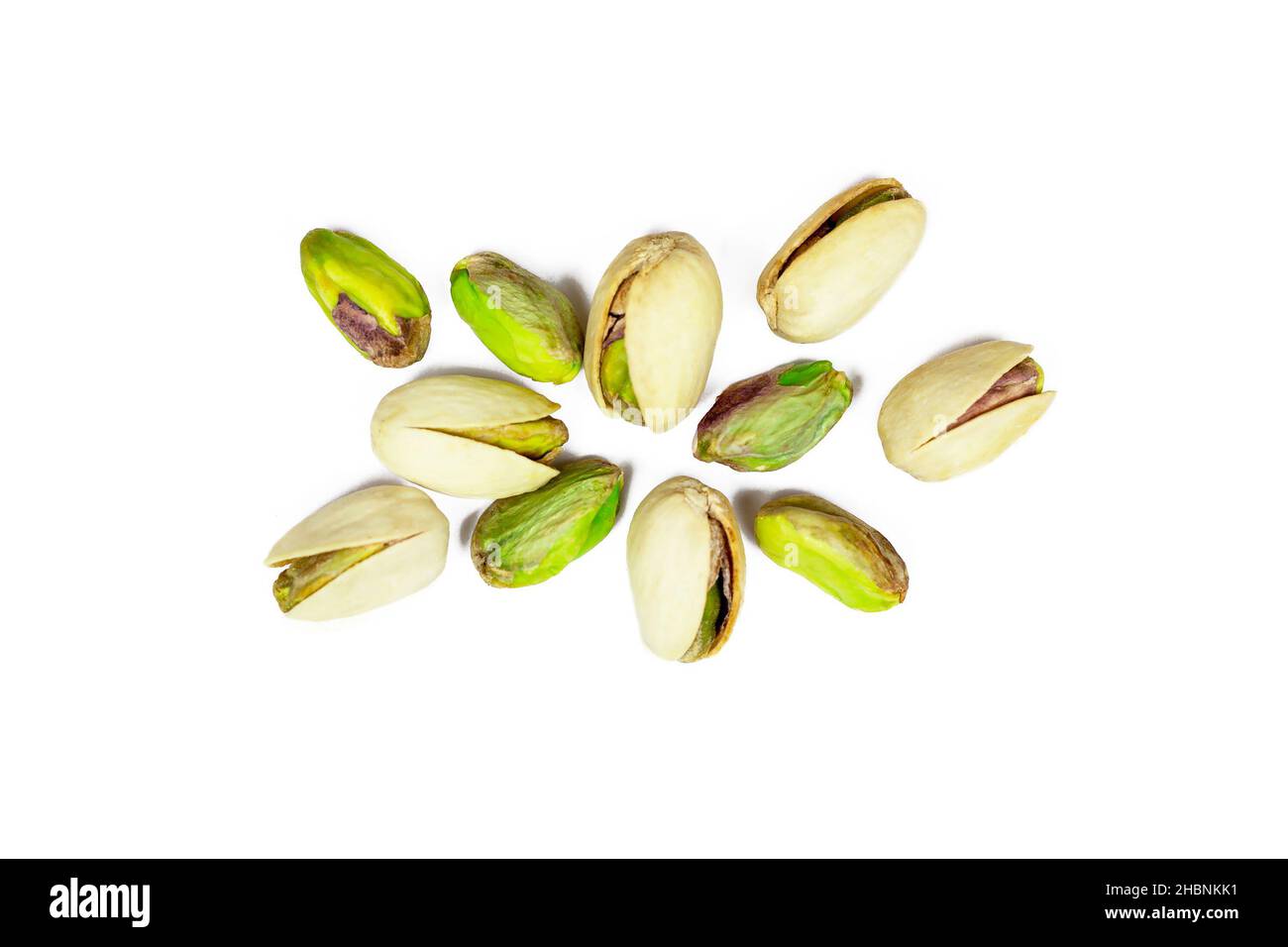 Top view of roasted salted pistachio nuts in nutshell isolated on white background Stock Photo ...