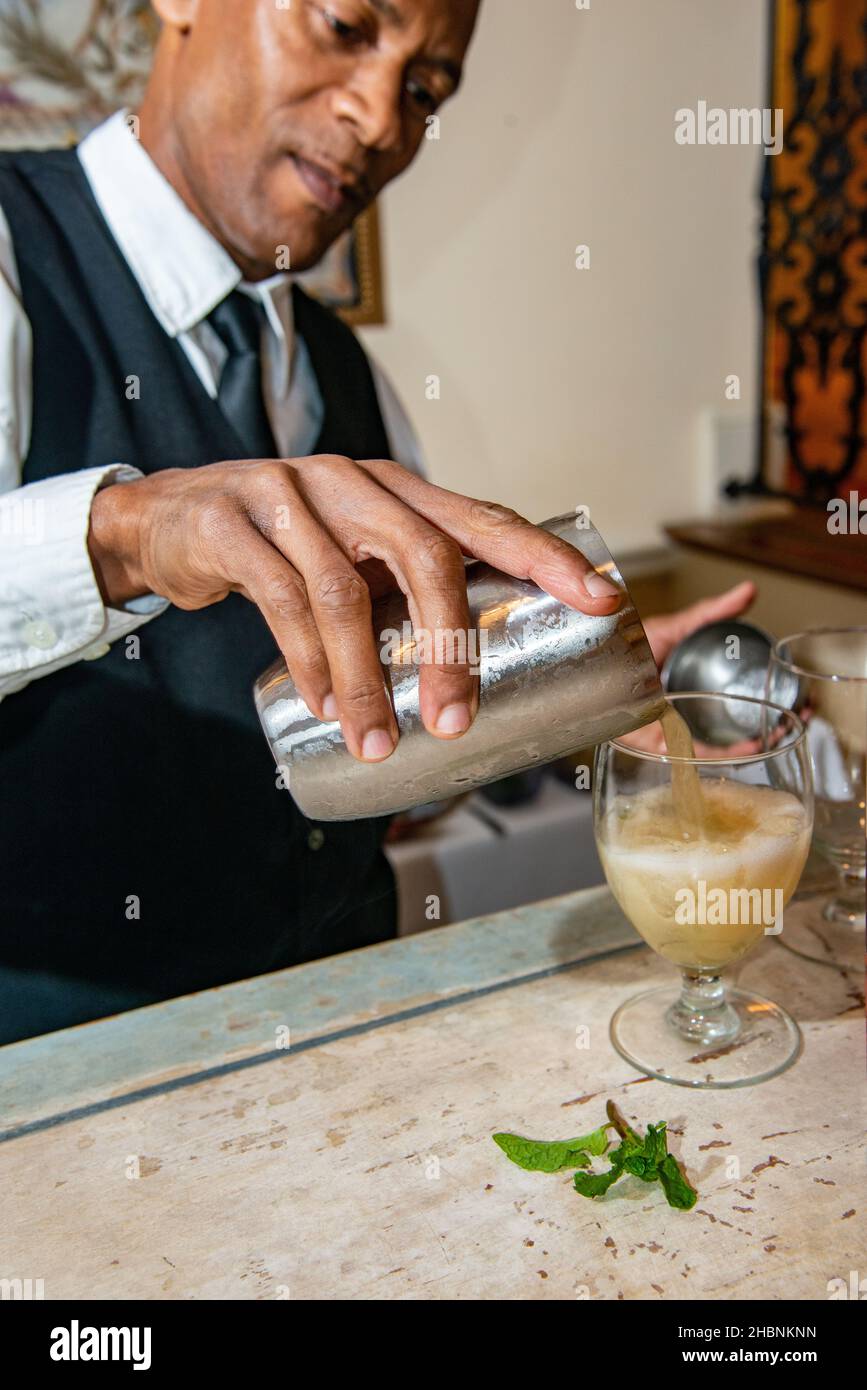 Bartender pouring a cocktail Stock Photo - Alamy