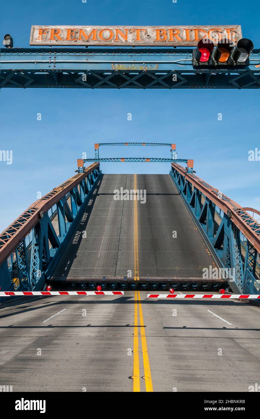 The double-leaf bascule drawbridge is midway between being open or ...