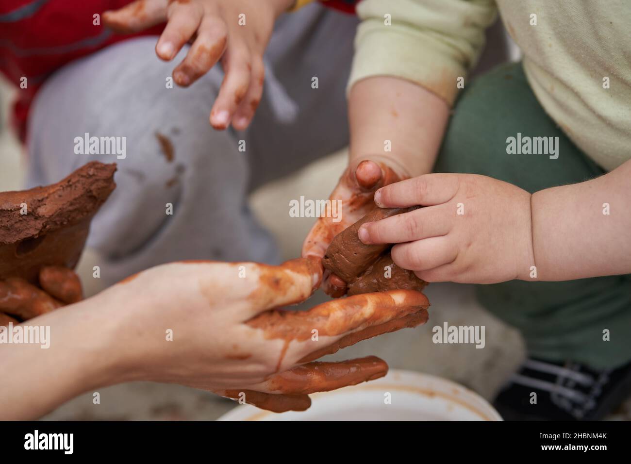 Hands moulding clay hi-res stock photography and images - Alamy