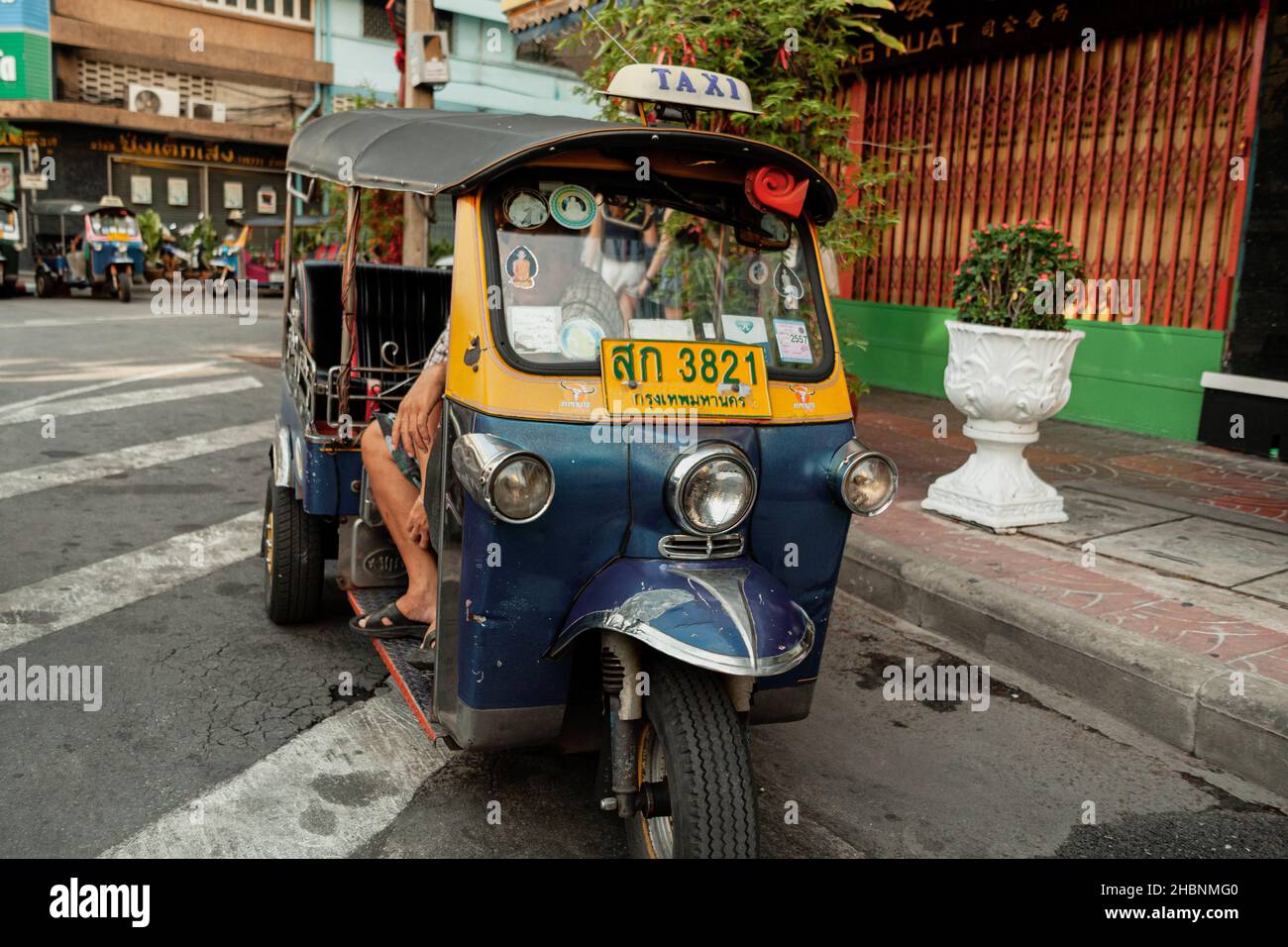 BANGKOK, THAILAND - MAY 3, 2014: Colourful three-wheeler taxi on the ...