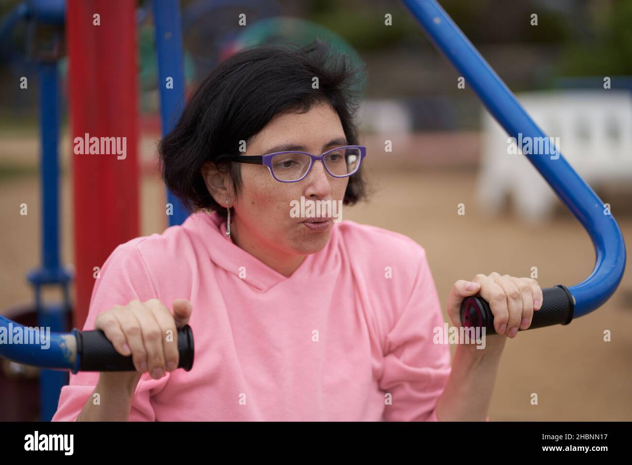 woman doing push-ups exhale. Woman in pink clothes exercises in the ...