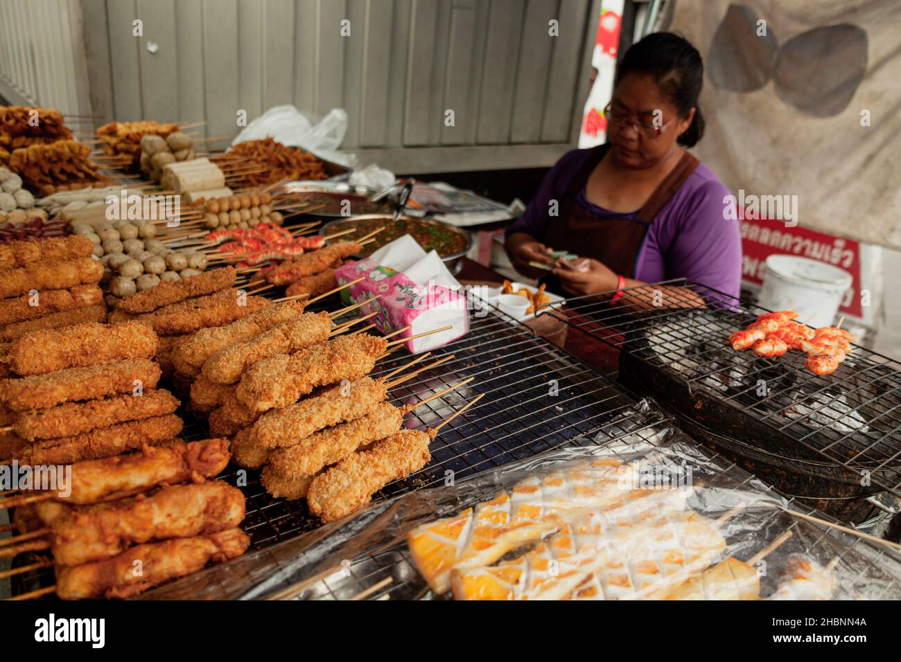 BANGKOK, THAILAND - MAY 3, 2014: Thai lady at the stall with street ...