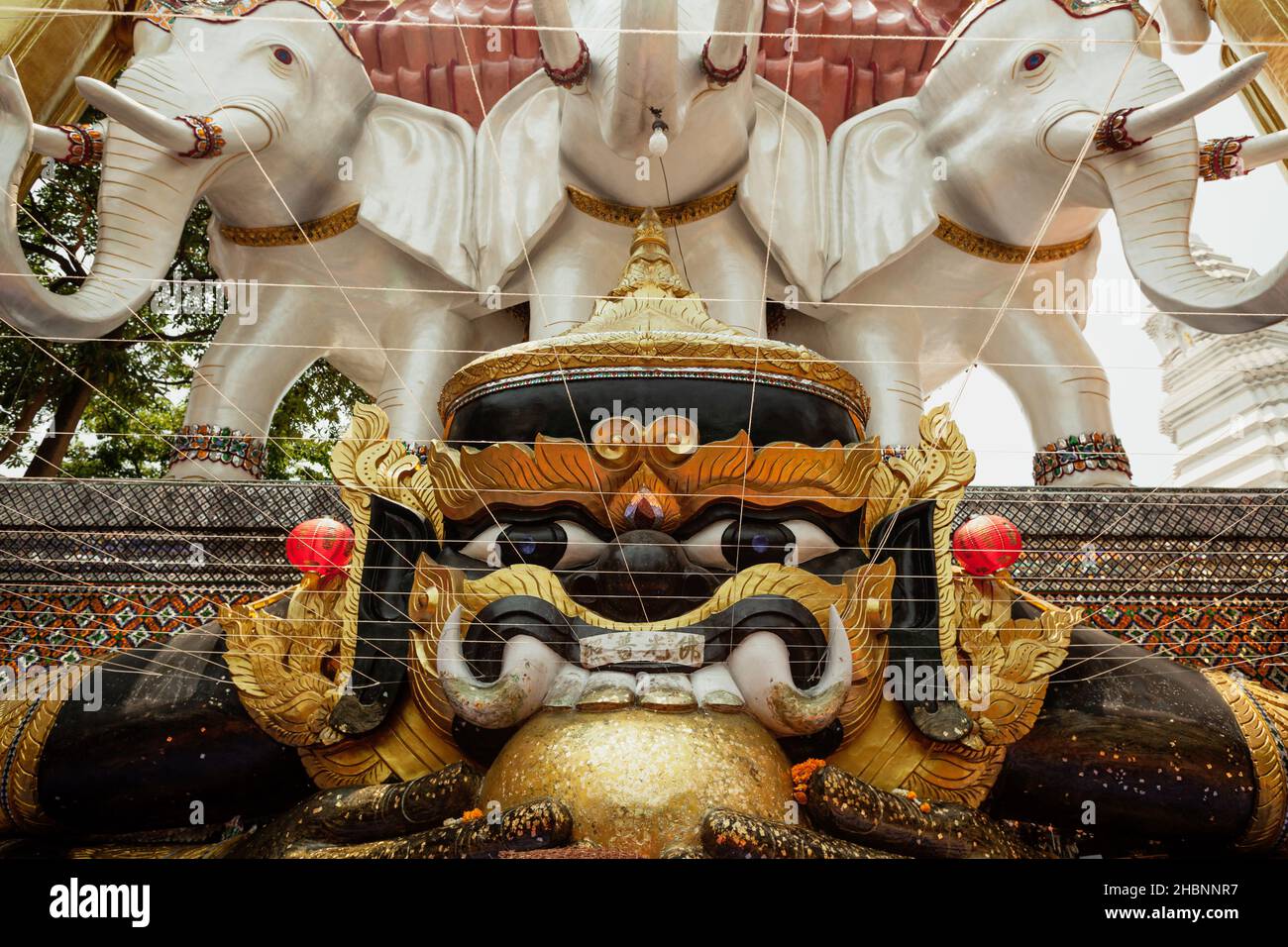 A statue of angry looking demon in Bangkok, Thailand Stock Photo - Alamy