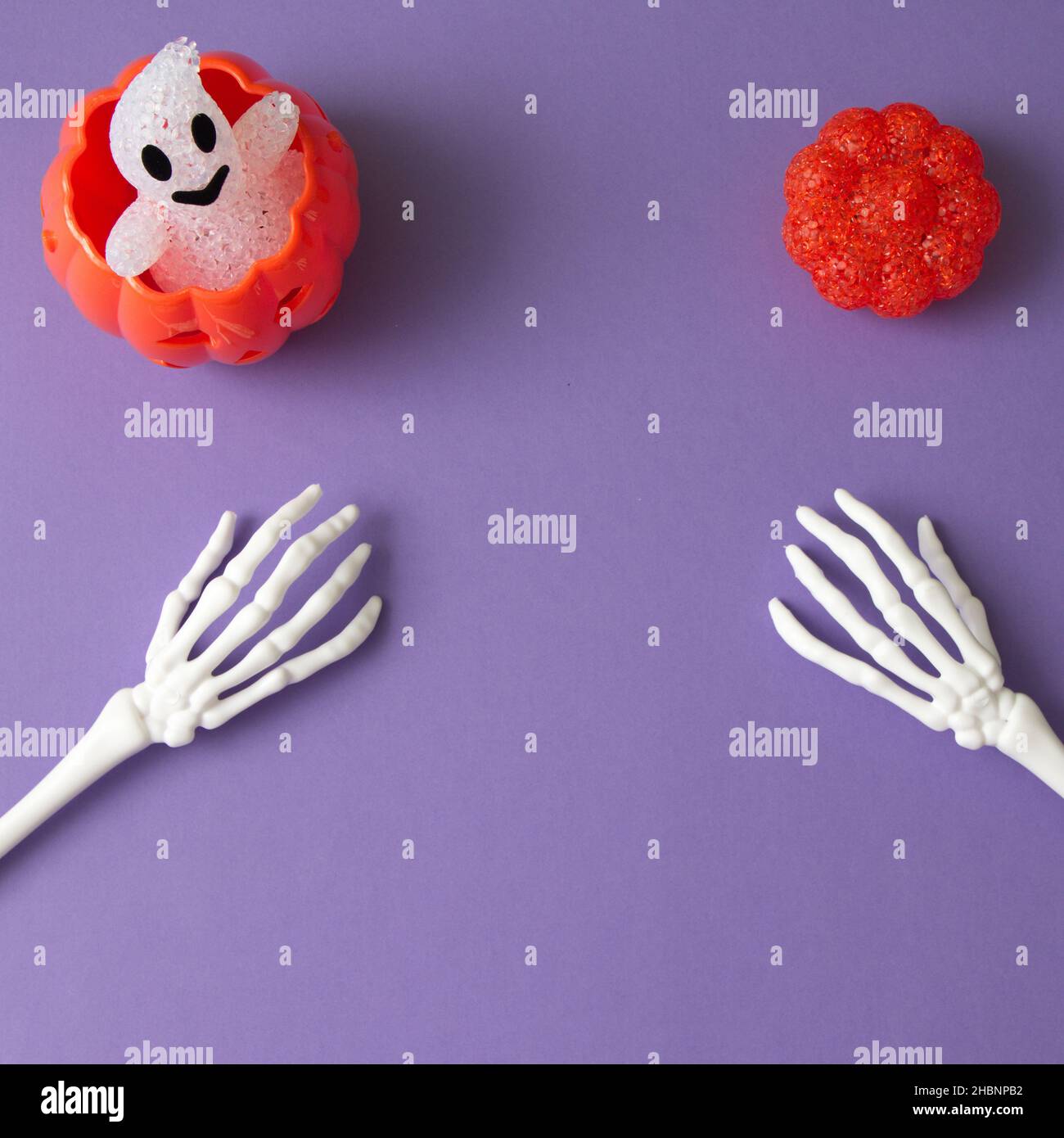 Two Pumpkins for Halloween with a ghost on a purple background with ...