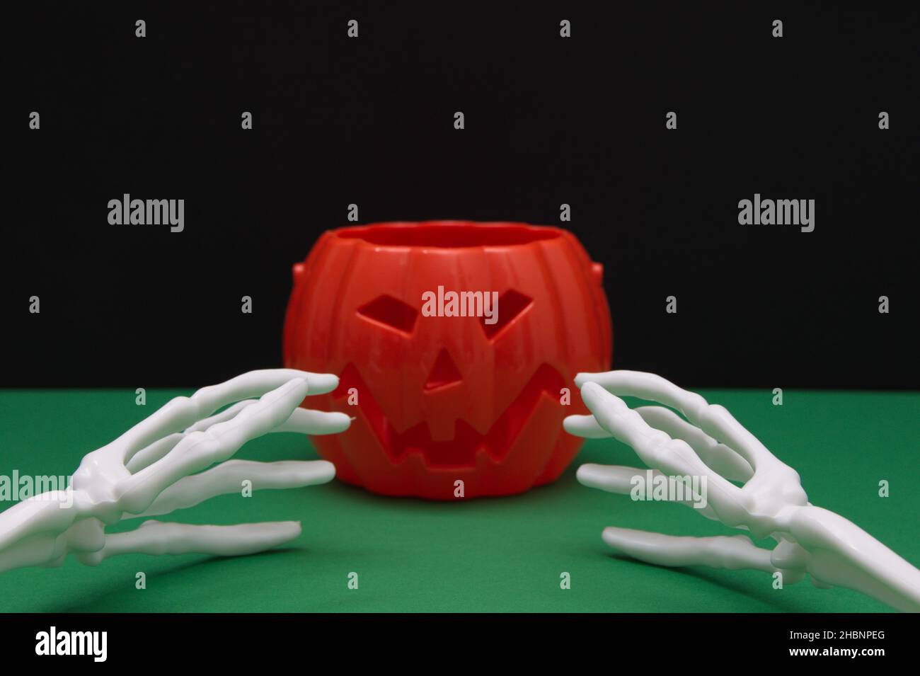 A pumpkin from Halloween and the bones of the hands that want to catch ...