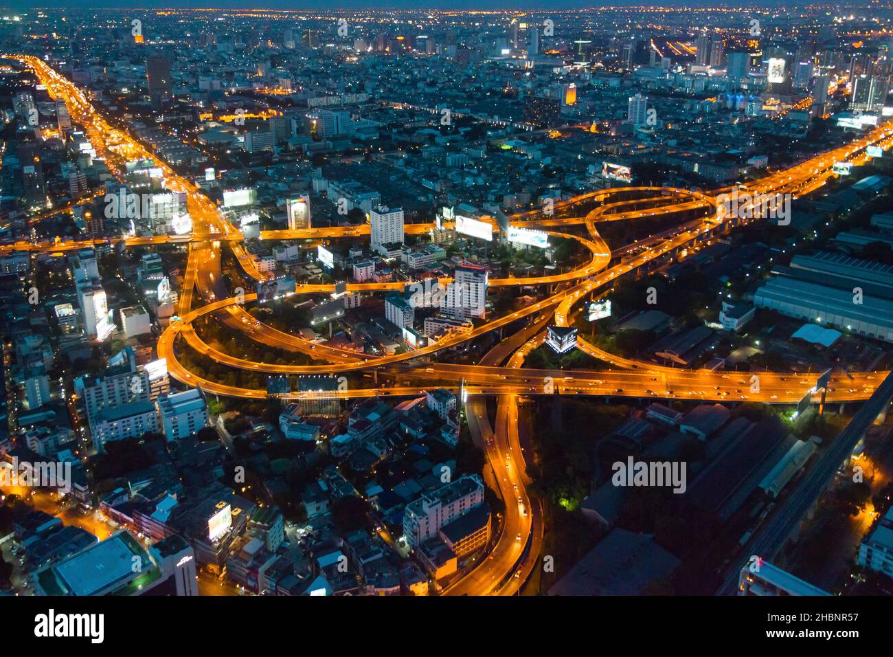 Aerial view of the illuminated flyover in Bangkok at night, Thailand ...