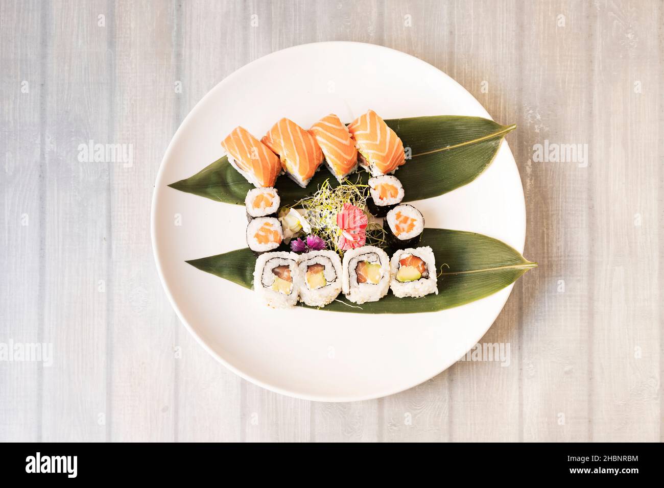 Sushi is a typical dish of Japanese origin based on rice seasoned with ...