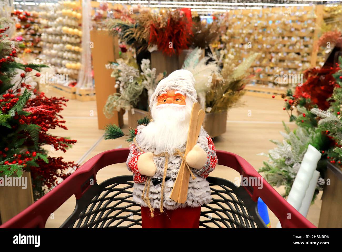 Funny Christmas Santa Claus on a supermarket trolley. Shopping in store ...