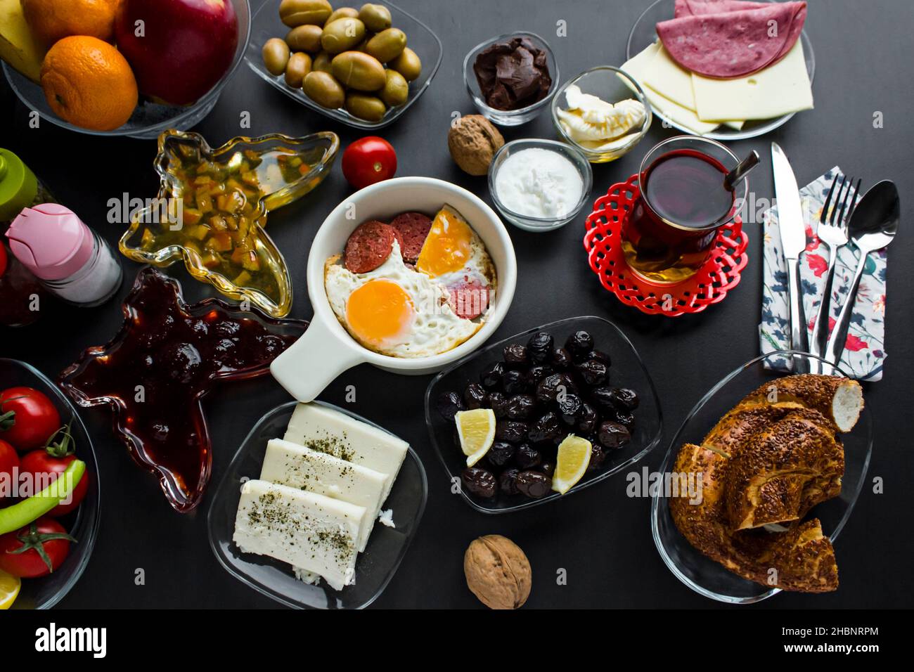 Traditional Turkish Breakfast on the black surface.Sausage and egg on ...