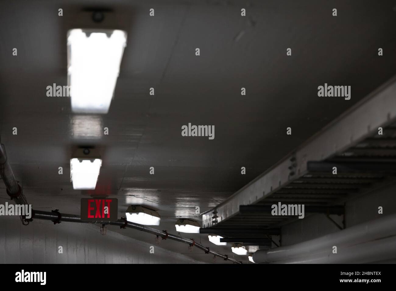 The lights and the exit sign on the ceiling of an underground Stock ...