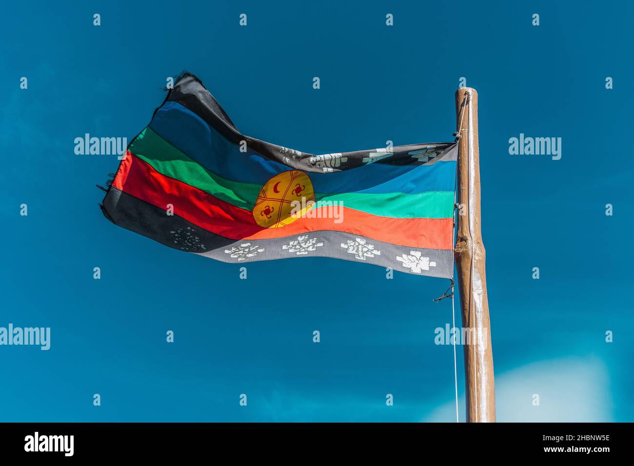 A Flag of the original Mapuche people in a blue sky Stock Photo - Alamy
