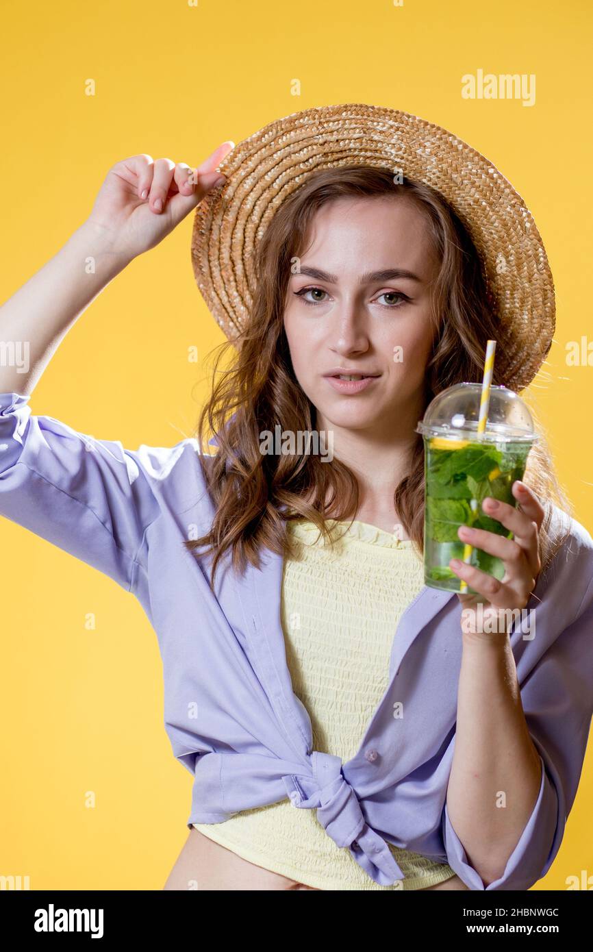 Summer refreshment. Cold beverage. young woman with plastic cup of fresh cocktail Non-alcoholic ...