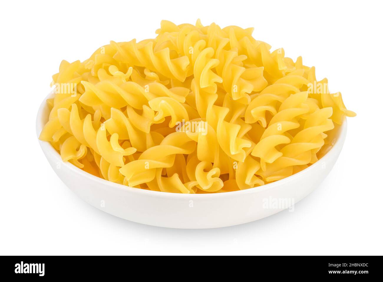 raw Fusilli pasta in ceramic bowl isolated on white background with ...