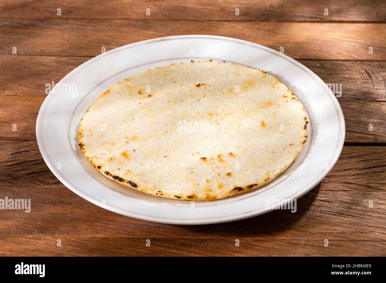 Arepa of ground corn - Traditional Colombian food Stock Photo - Alamy