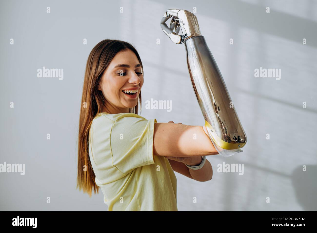 Portrait of a strong and independent woman with a bionic prosthetic arm ...