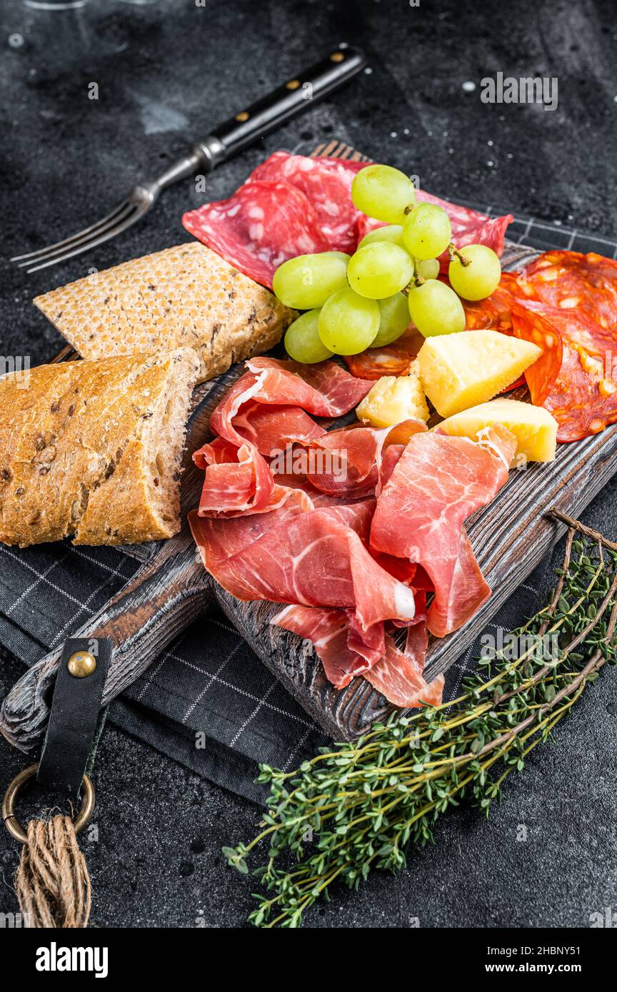 Cold meat plate, charcuterie - traditional Spanish tapas on a wooden ...