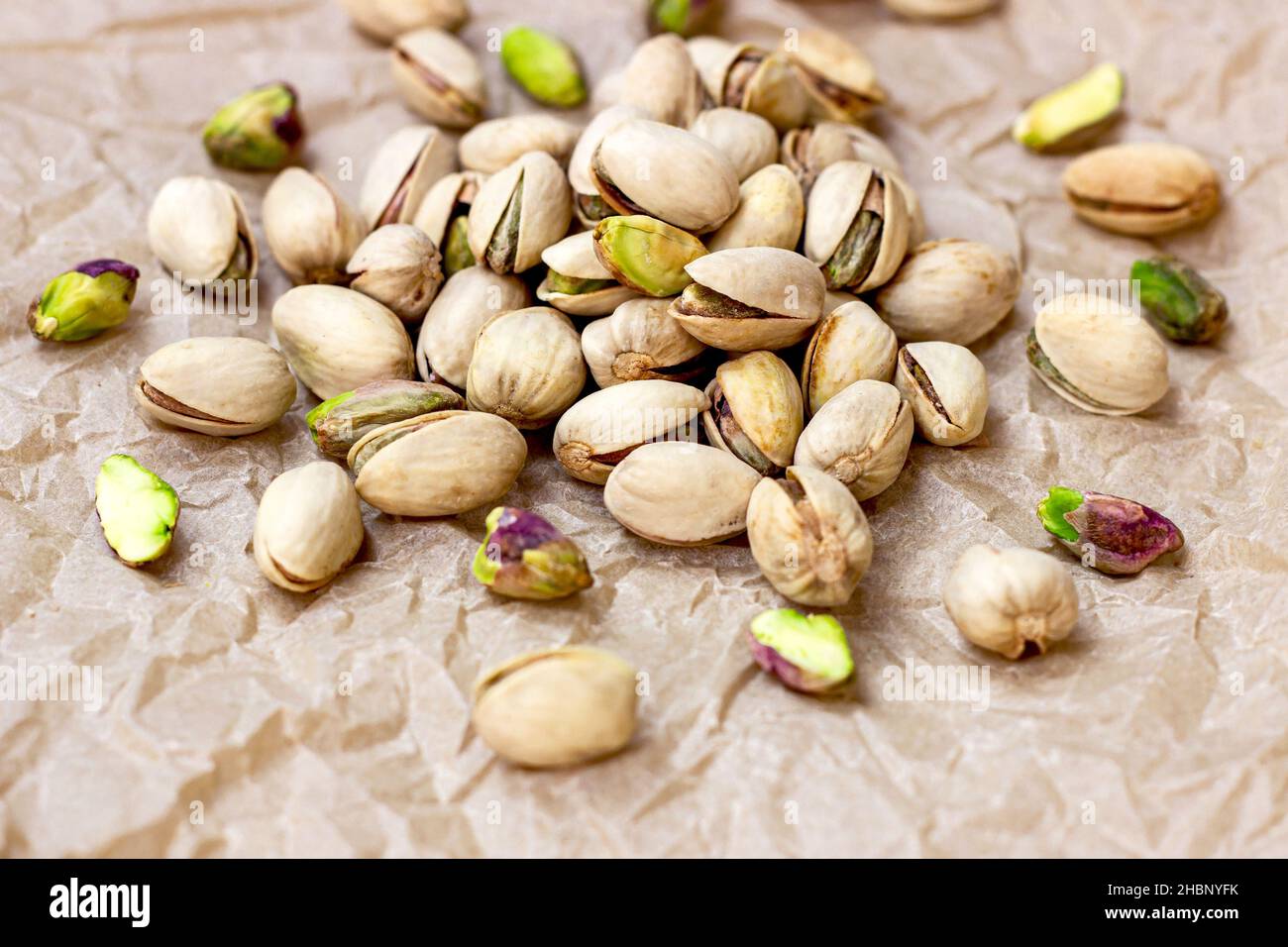 Roasted salted pistachio nuts in nutshell on light background Stock Photo - Alamy