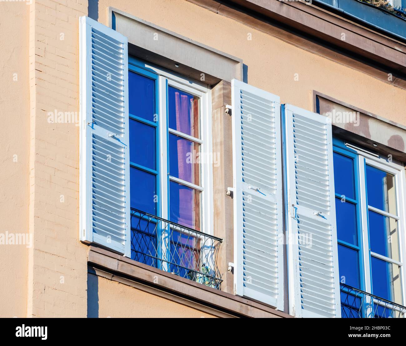 French apartment building with blue windows protected by UV thin film ...