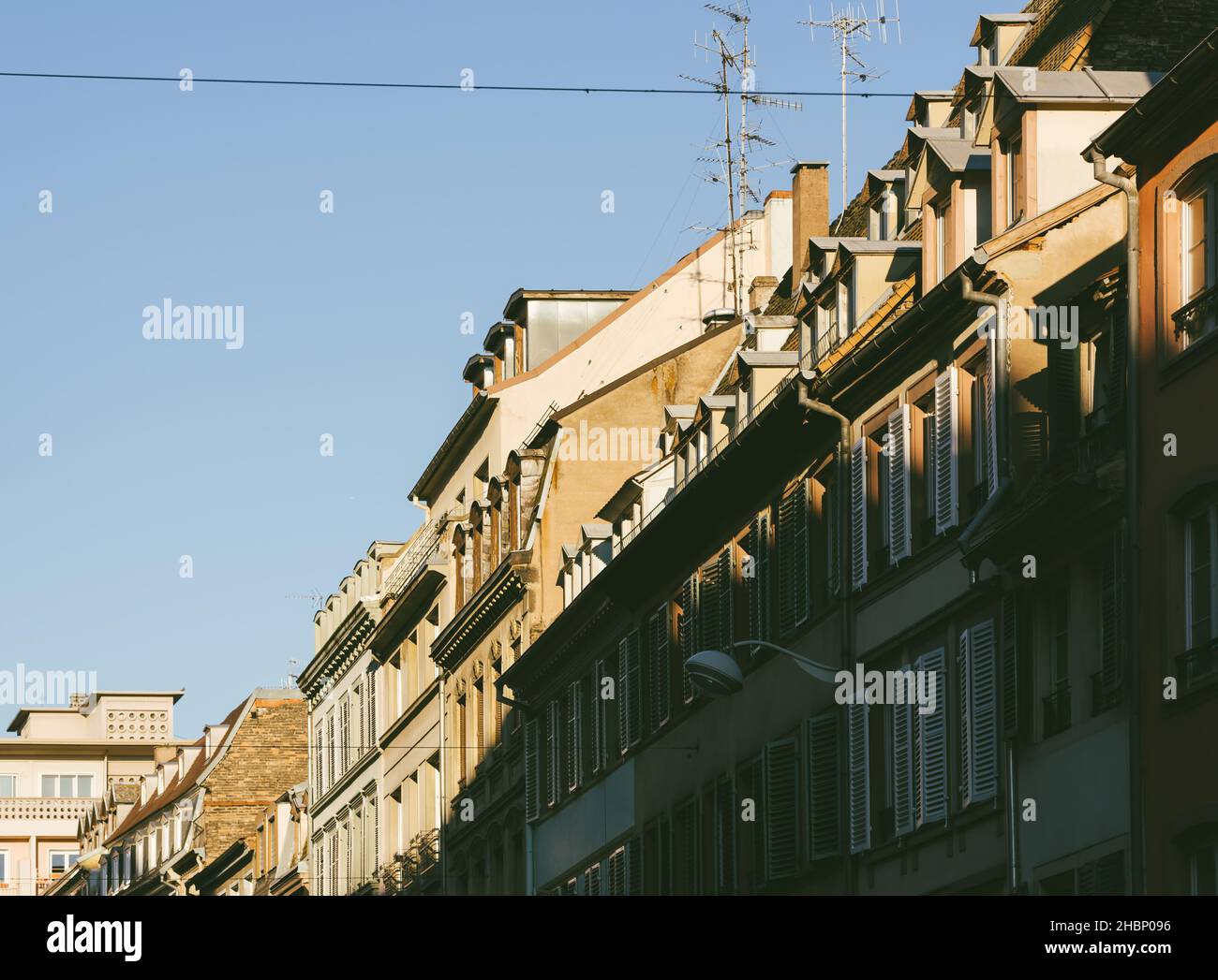 Row of multiple windows on the rooftops of Haussmannian apartment ...
