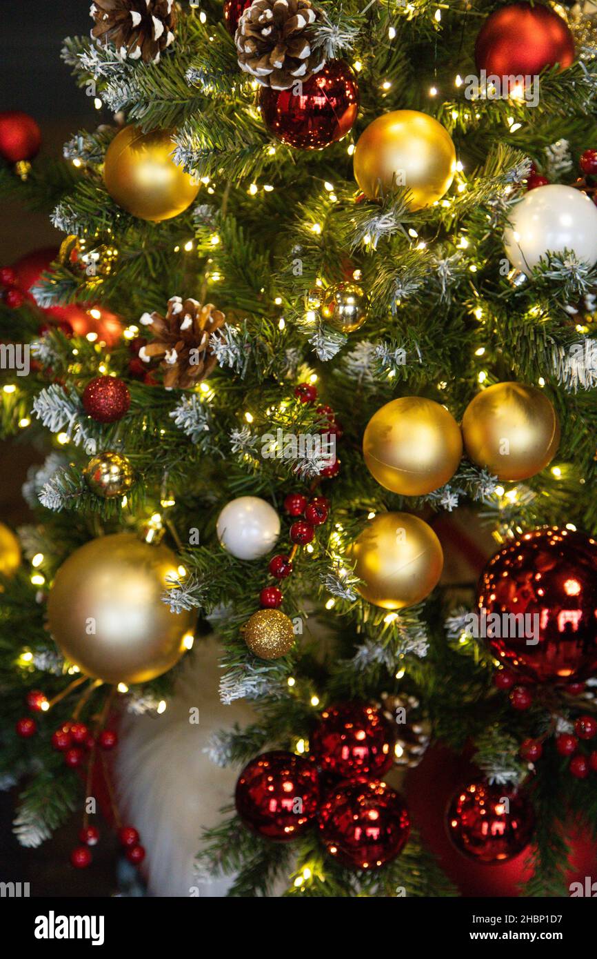 christmas tree with red and gold toys Stock Photo - Alamy