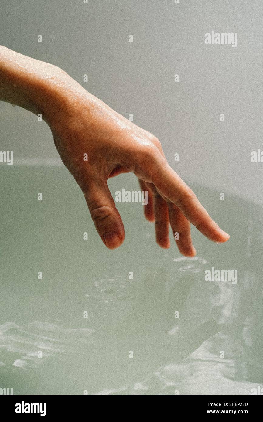 beautiful hand with a drop of water Stock Photo - Alamy