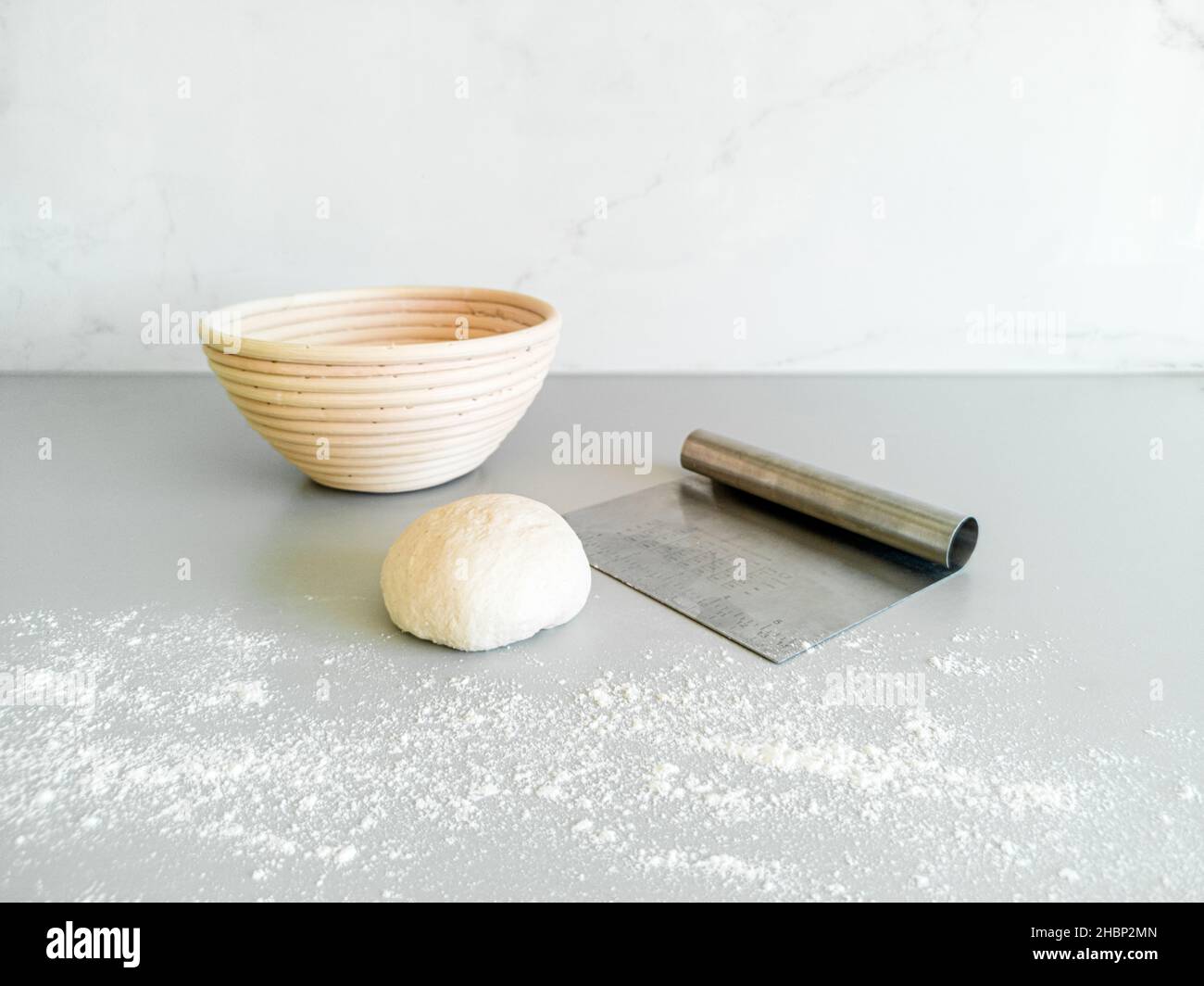 Front View on bread baking inventory and piece of dough on the table ...