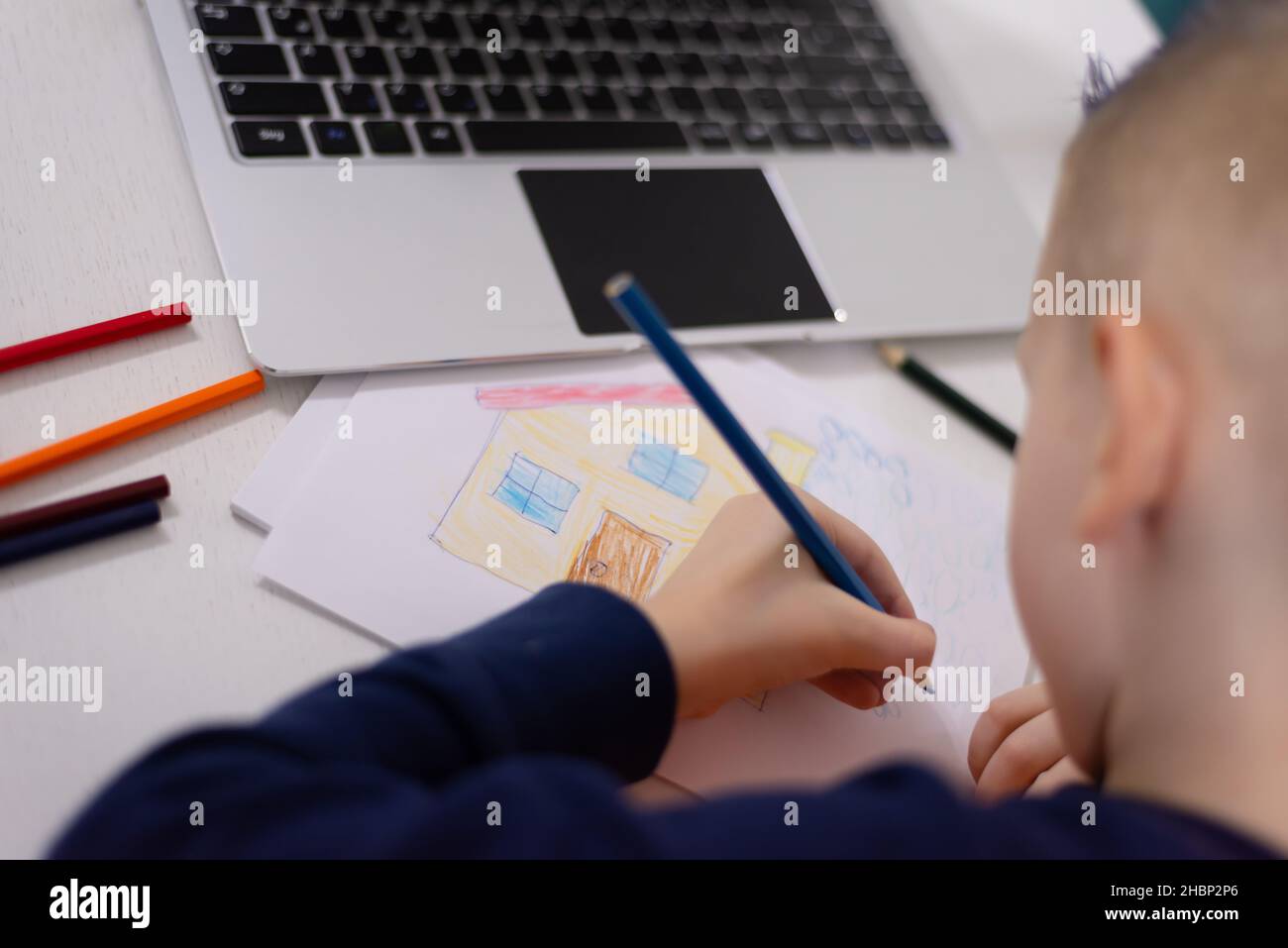 Remote learning concept with boy using laptop. Little boys attending to ...