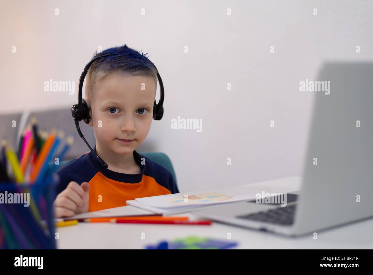 Remote learning concept with boy using laptop. Little boys attending to ...