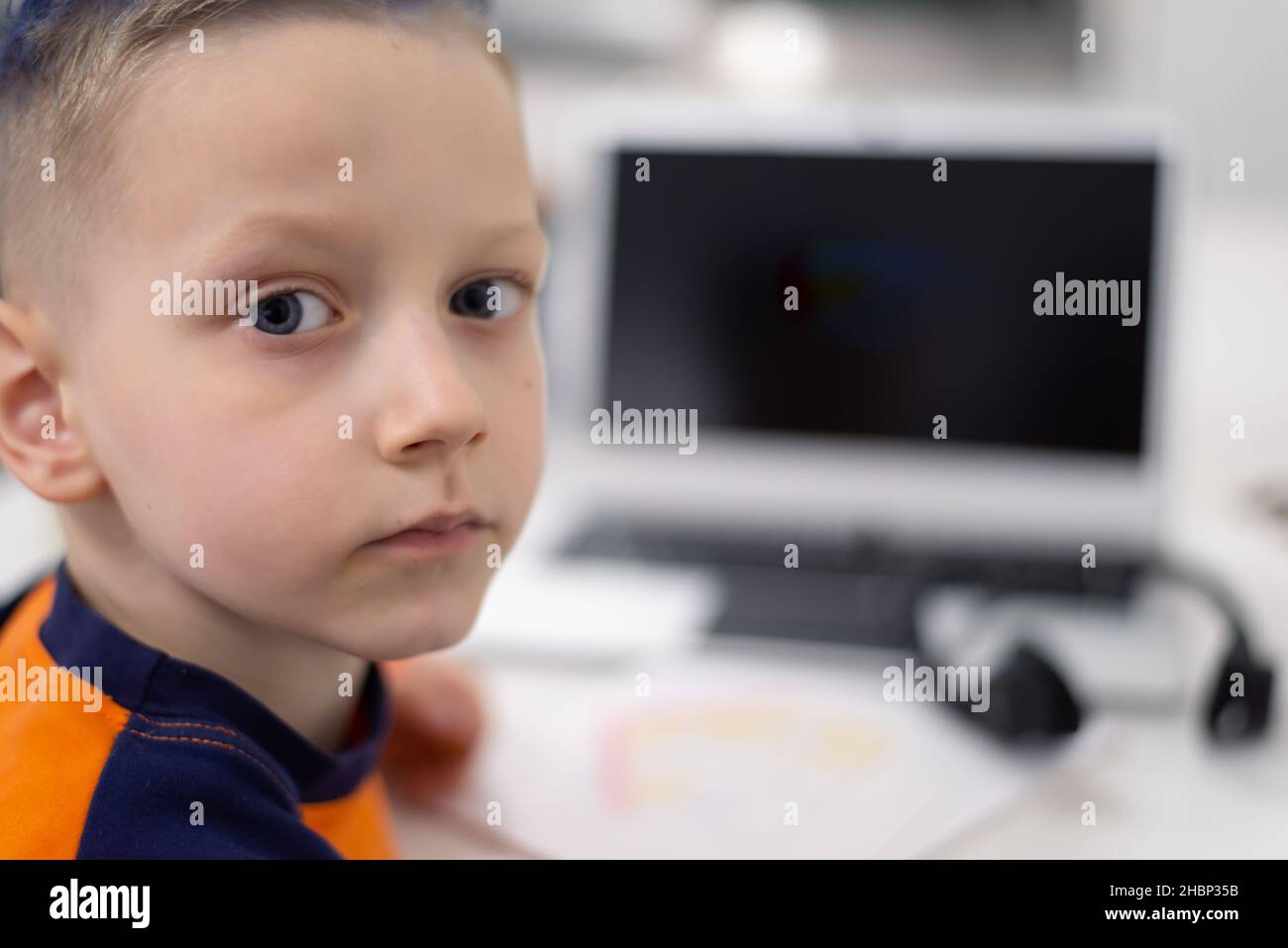 Remote learning concept with boy using laptop. Little boys attending to ...