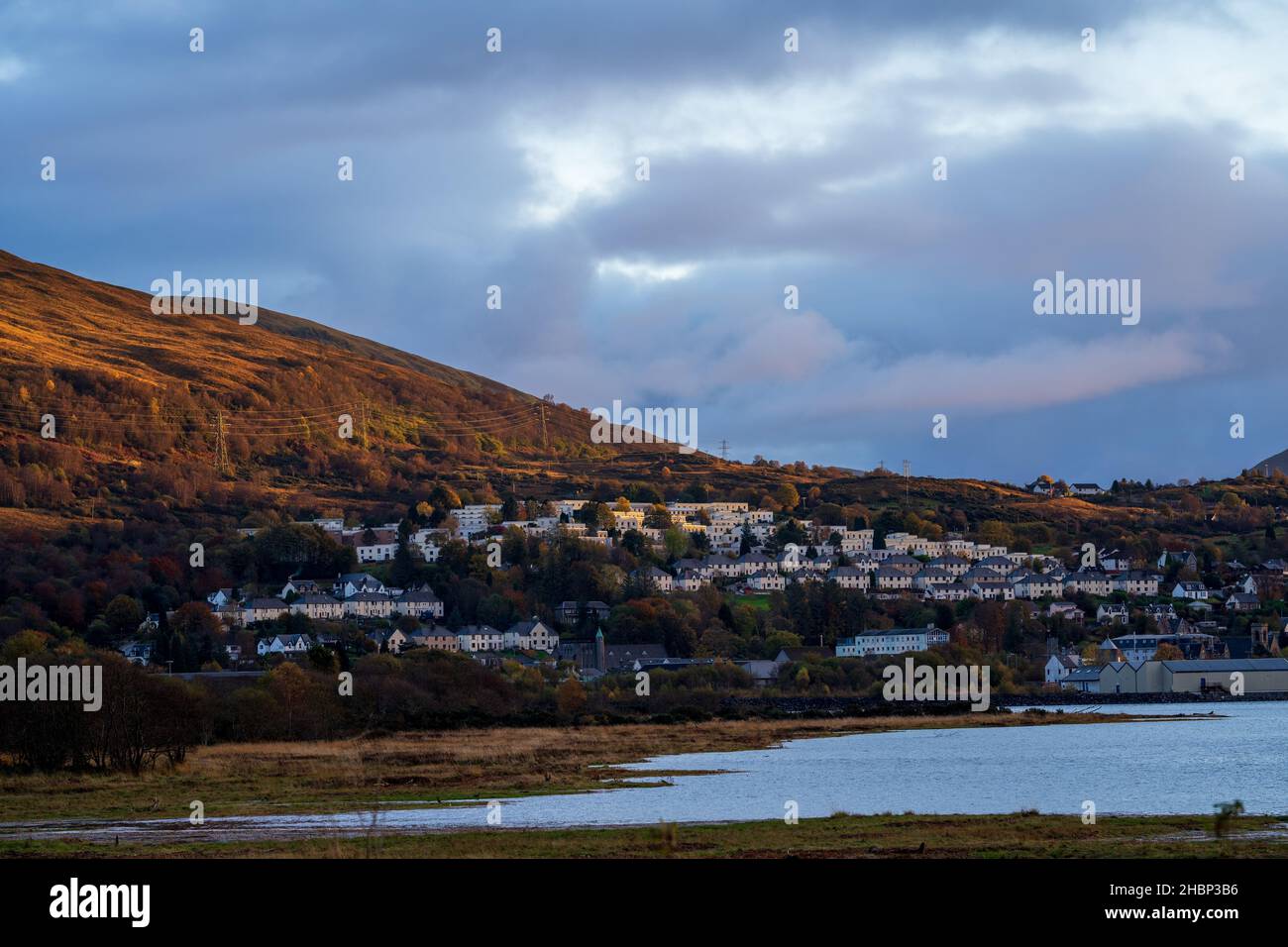 A grounded fishing boat on a beach at Loch Linnhe, with Ben Nevis in ...