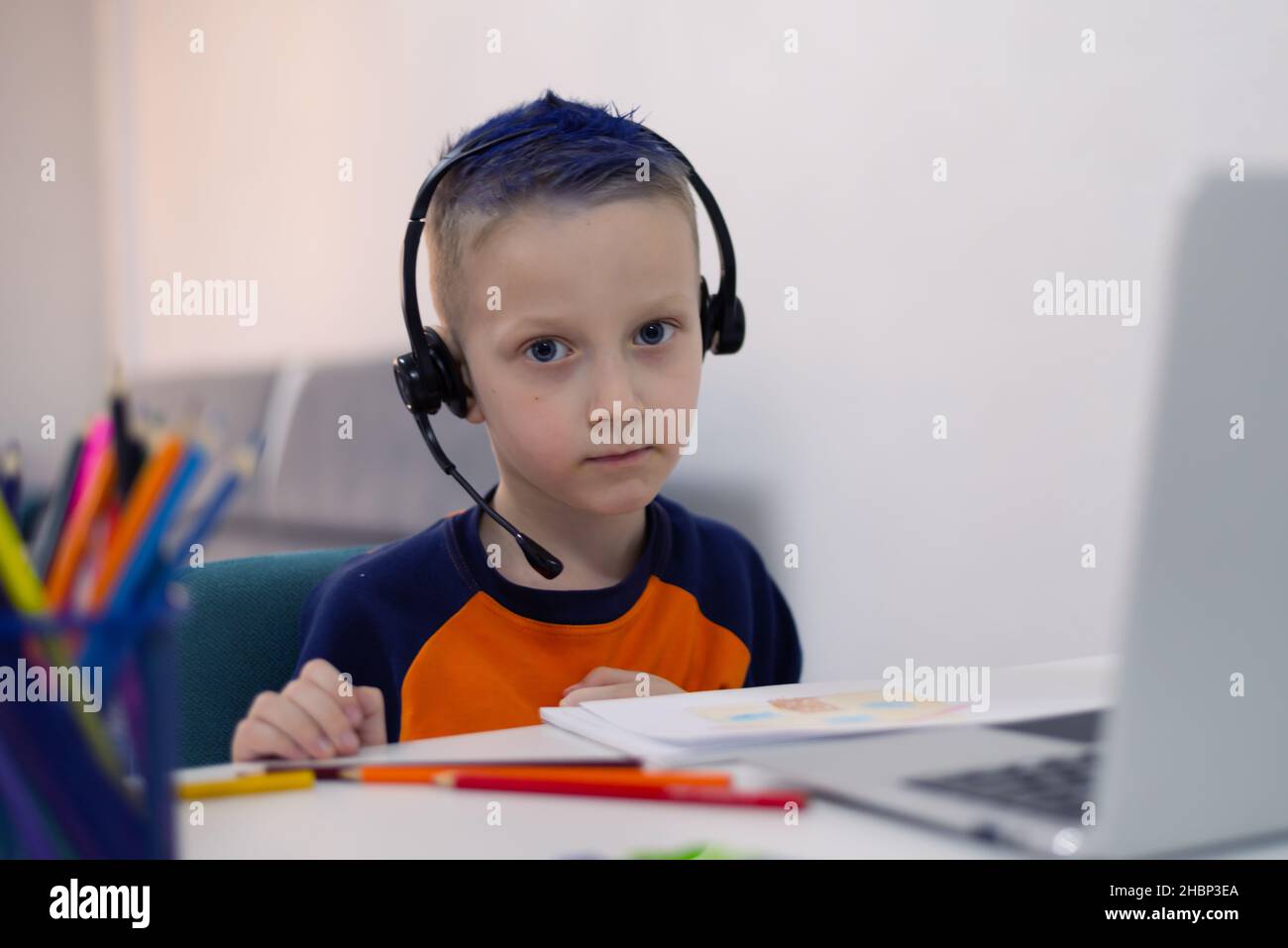 Remote learning concept with boy using laptop. Little boys attending to ...