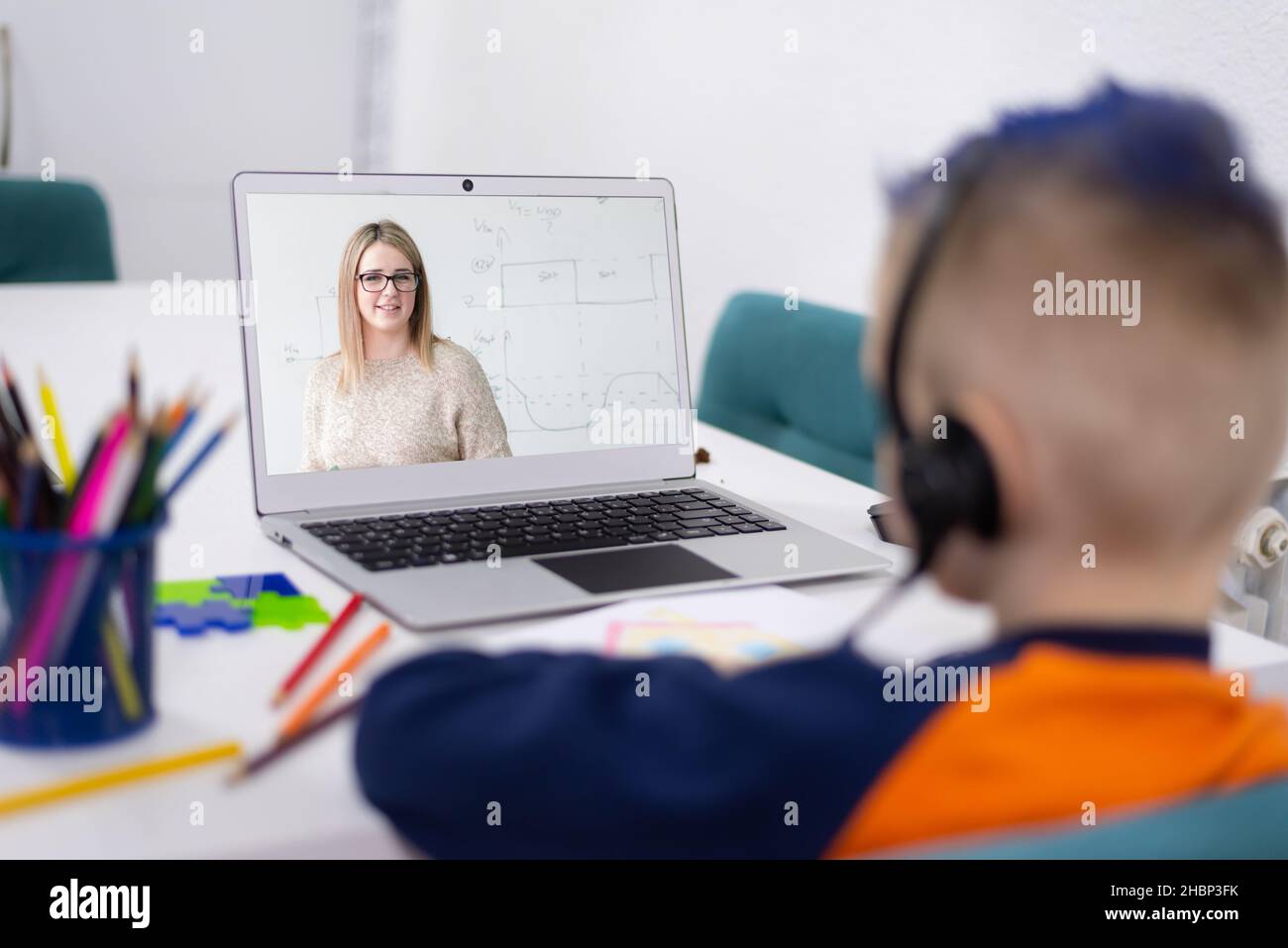 Remote learning concept with boy using laptop. Little boys attending to ...