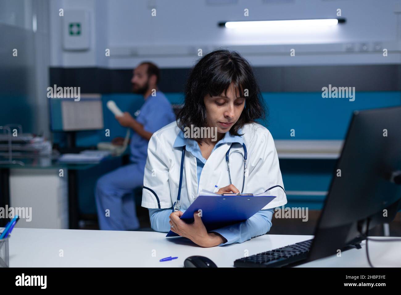 Doctor nurse looking documents hi-res stock photography and images - Alamy