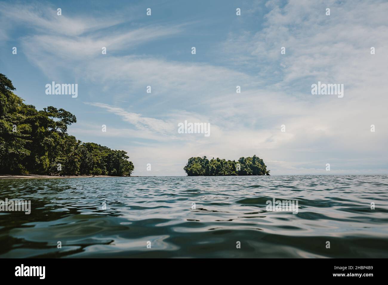 The blue sky over the sea captured from the coast in Punta Mona, Costa ...