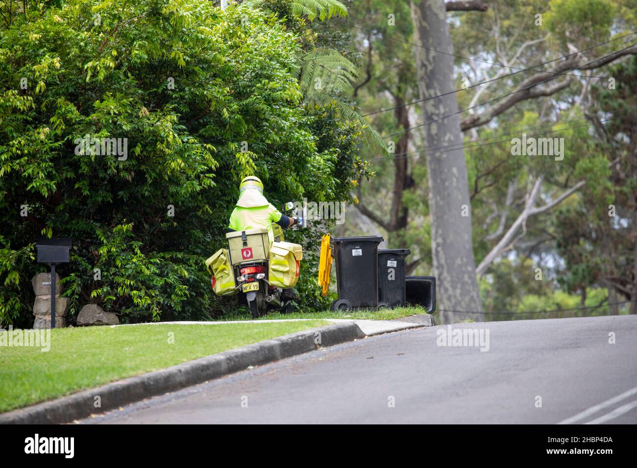 Australia post delivery bike rider delivers mail to houses in Sydney ...