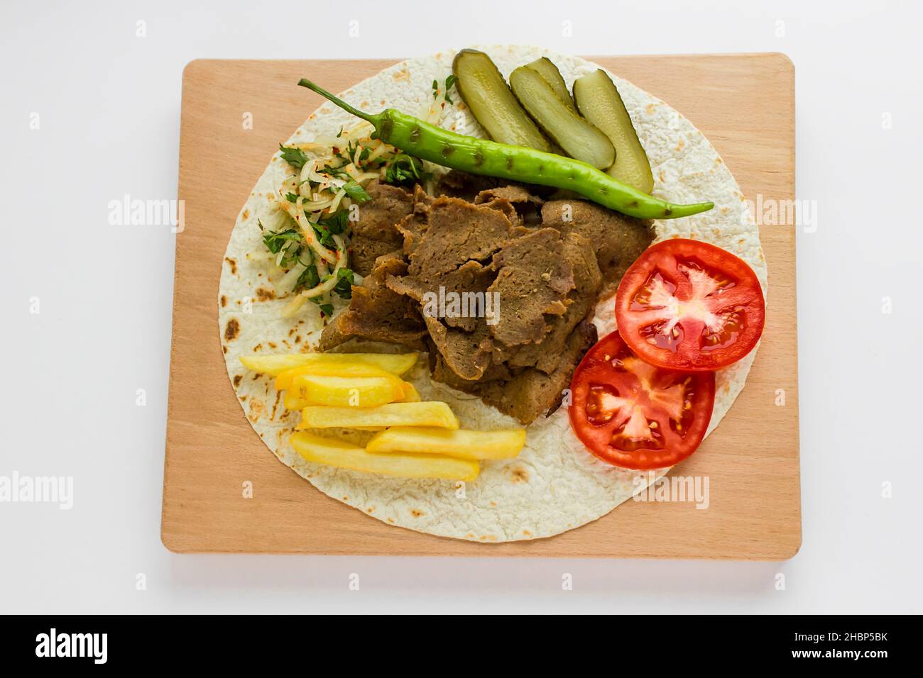 Traditional Turkish kebab doner with sliced tomatoes,grilled vegetables ...