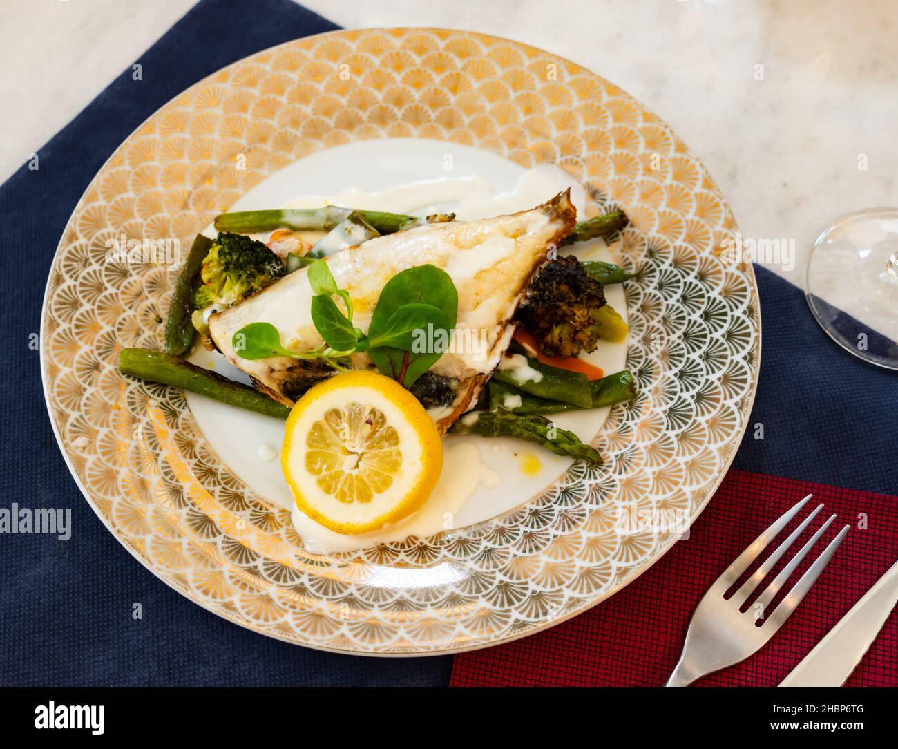 Delicious fish dish - dorado fish fillet served with vegetables Stock ...