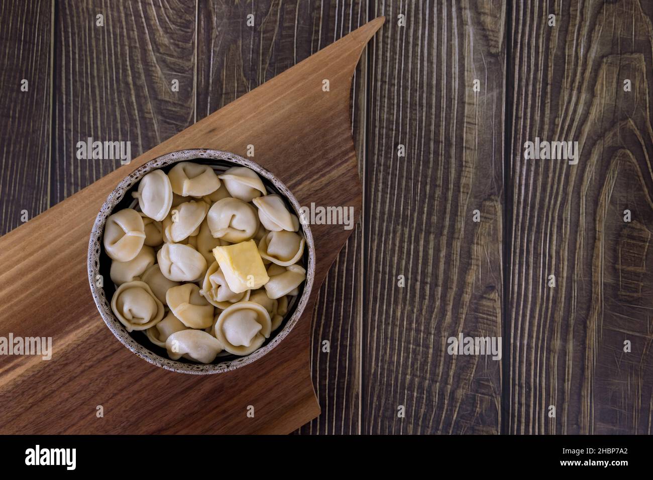 Russian dumplings pasta with meat and onion on wooden rustic background ...