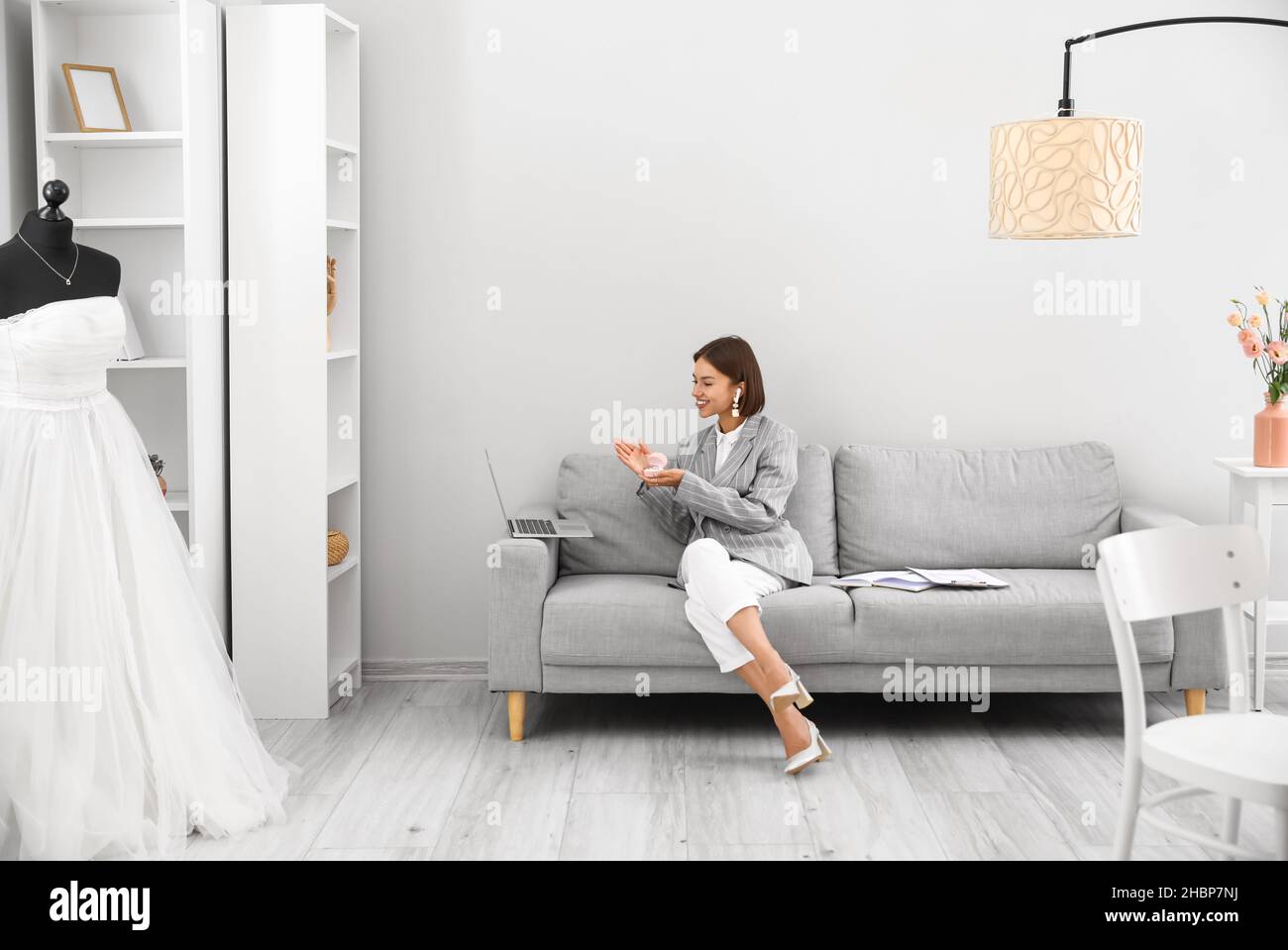 Female wedding planner working in office Stock Photo - Alamy