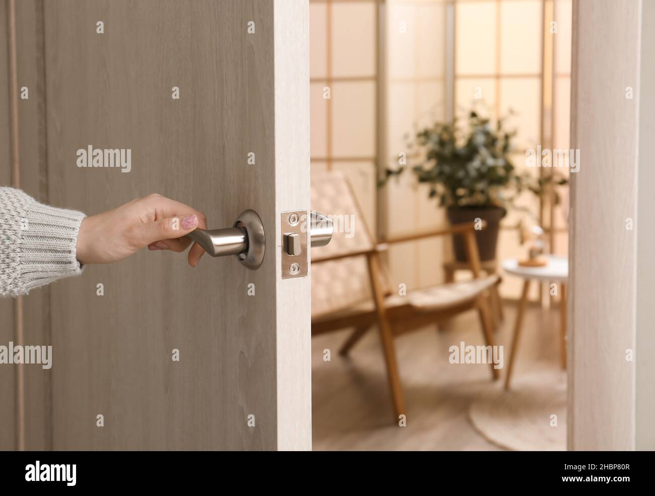 Woman hand opening wooden door hi-res stock photography and images - Alamy