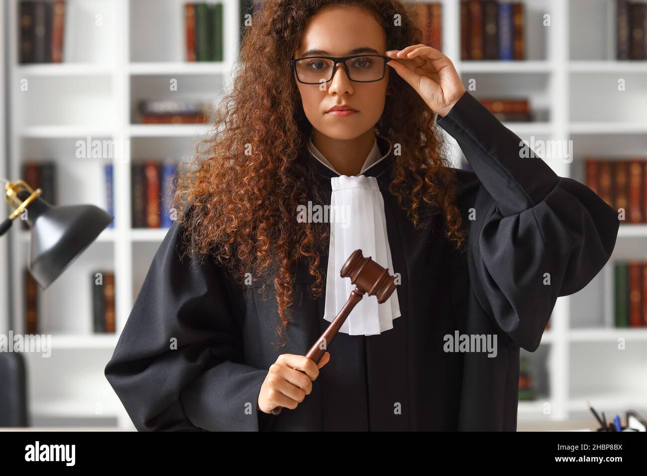 Female judge with gavel in courtroom Stock Photo - Alamy