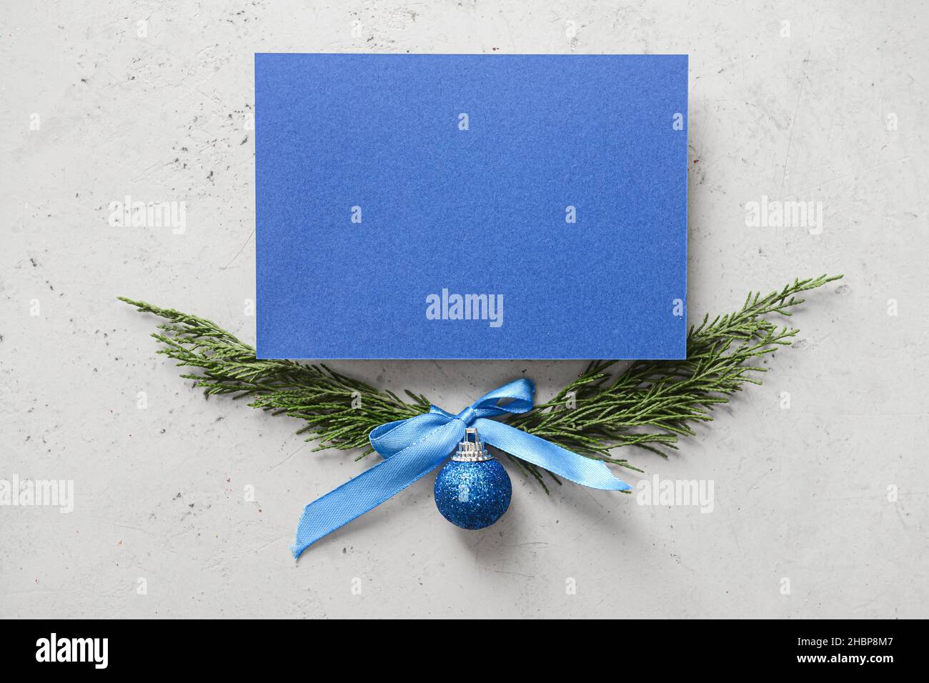 Empty greeting card with Christmas decorations on light background ...